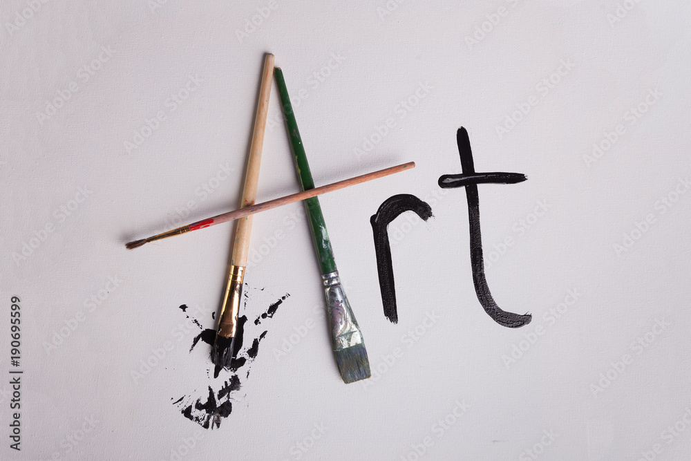 Art written in paint and paint brushes on canvas Stock Photo | Adobe Stock