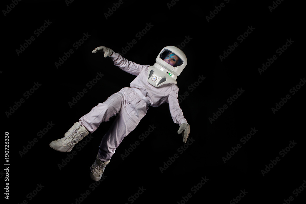 Astronaut in space, in zero gravity on black background. Man in space ...