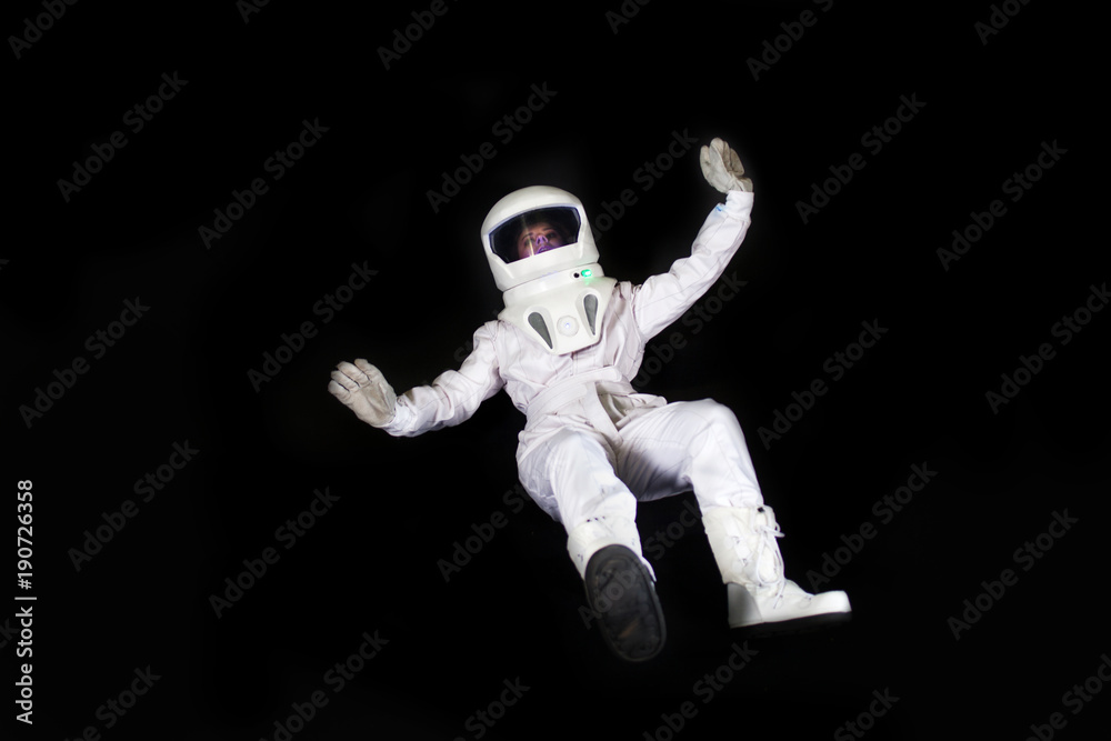 Astronaut in space, in zero gravity on black background. Man in space ...