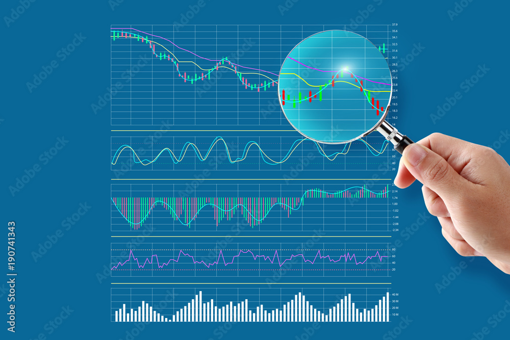 Stock Analysis ideas concept hand holding Magnifying glass trading ...