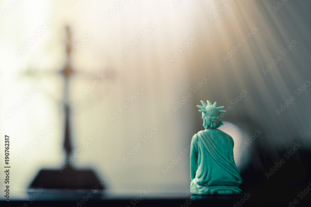 Back view of The Statue of Liberty bow down and praying to GOD and ...