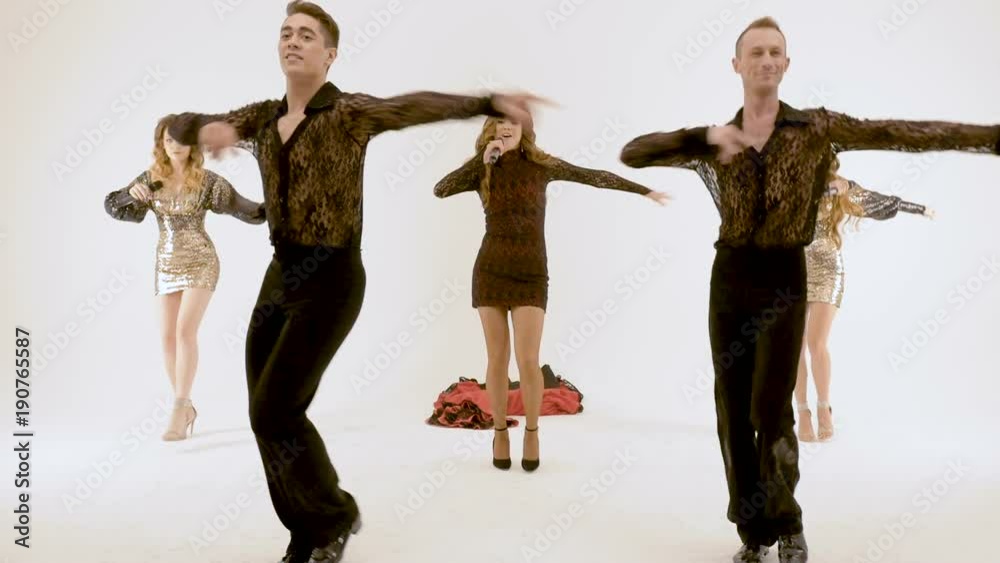 A group of professional actors dancing on a white background. The girl ...