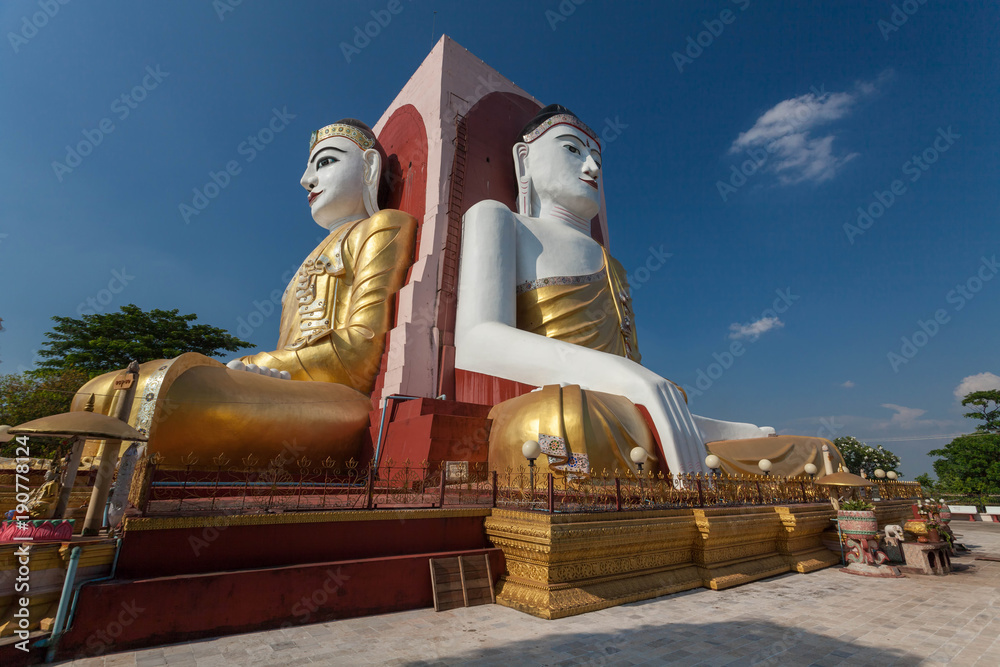 The Kyeik Pun Pagoda in Bago in Myanmar. the pagoda has four giant ...