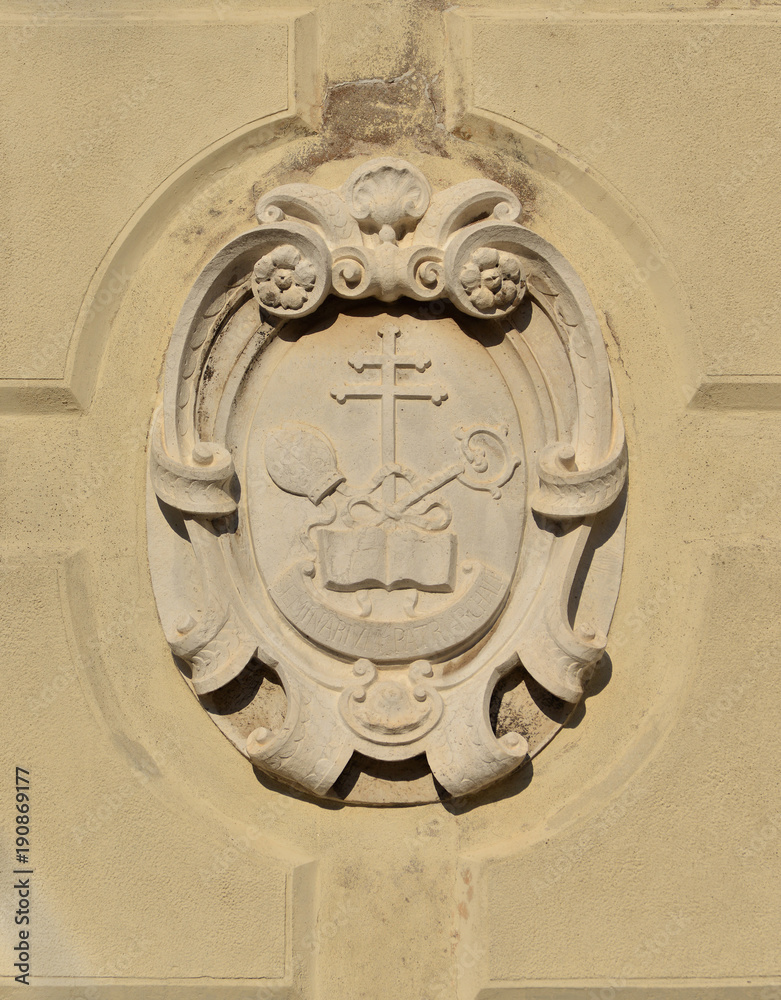 Cross, crosier and mitre, christian religious symbols old relief on a ...