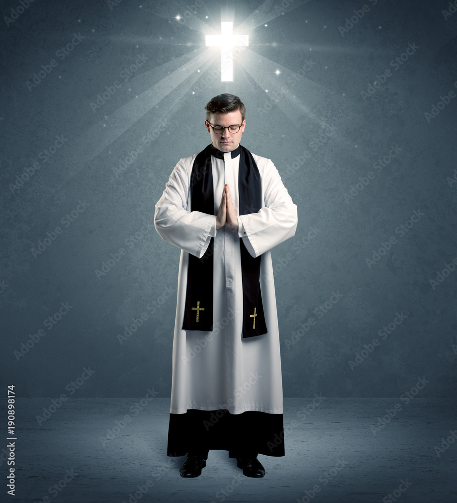 young priest in giving his blessing Stock Photo | Adobe Stock