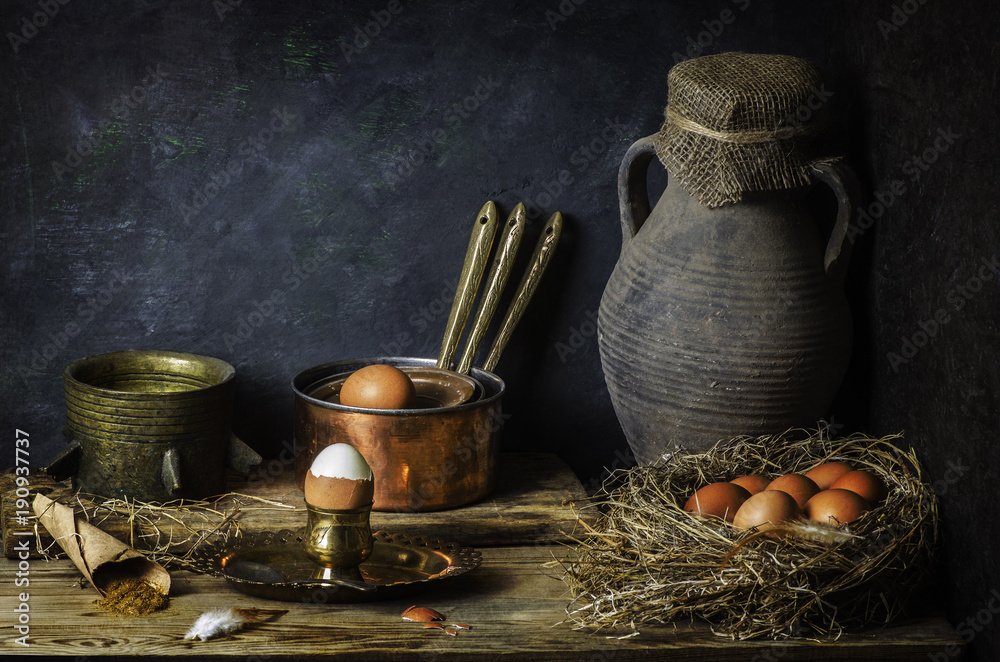 Classic still life with chicken eggs place in nest with old jar,copper ...