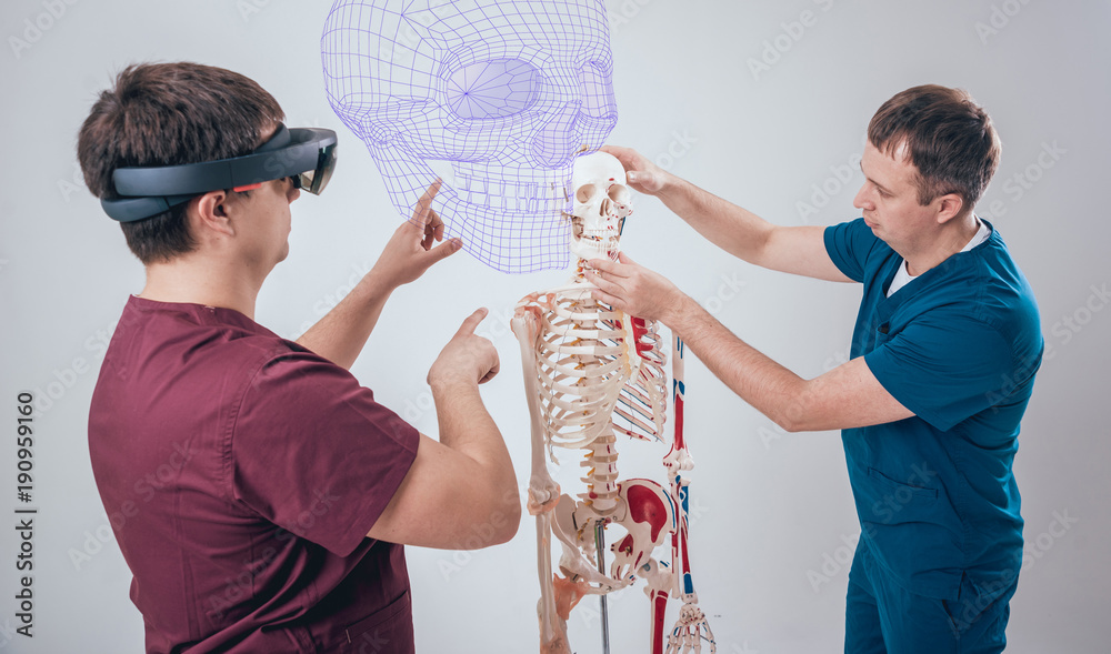 Doctor uses augmented reality goggles and human skeleton for teaching ...