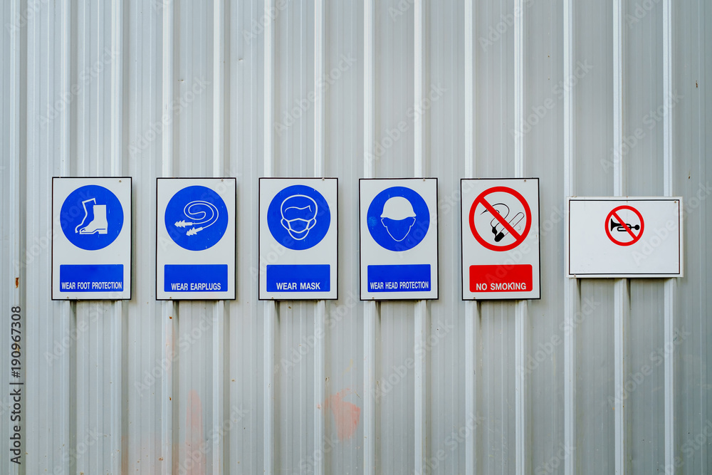 Safety clothing or personal protective equipment and prohibition signs ...