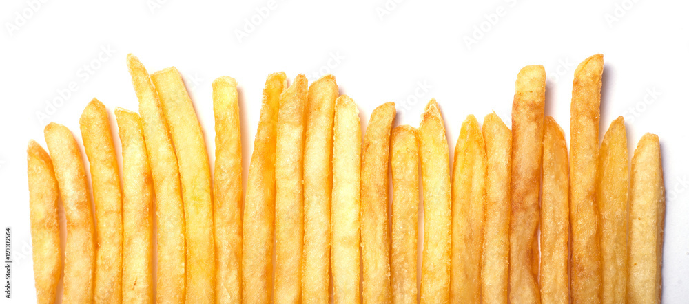Heap of French fries lined up in a row isolated on white background ...