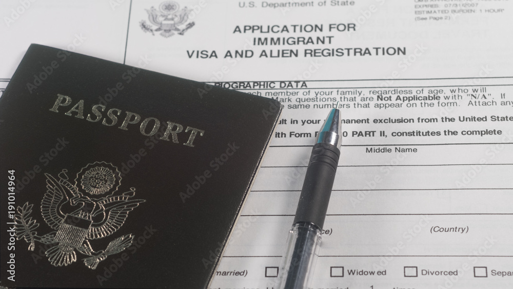 Application for immigrant visa form and US passport Stock Photo | Adobe ...