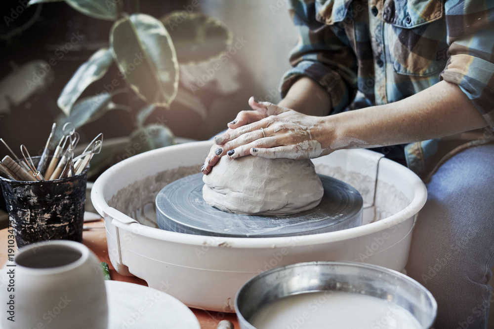 Ceramic studio, craft working process with clay potter's wheel, close ...