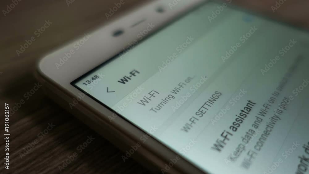 Smartphone connecting to WiFi close-up. A person connects to a wi-fi ...