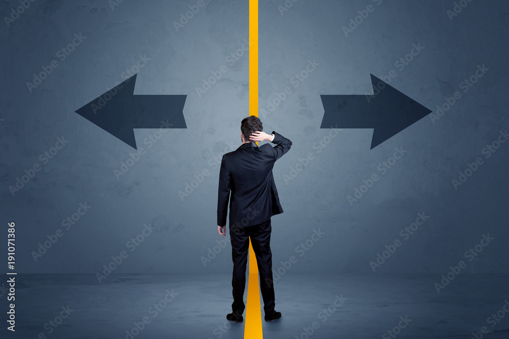 Business person choosing between two options separated by a yellow ...
