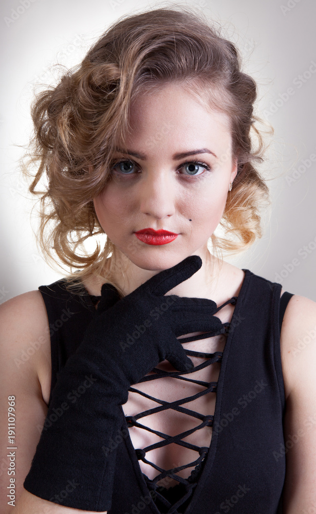 Pretty blond girl model like Marilyn Monroe in black dress with red ...