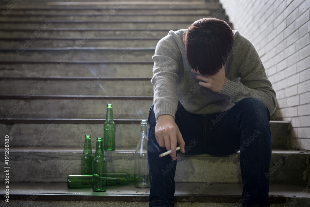 depressed man sit in underground Stock Photo | Adobe Stock