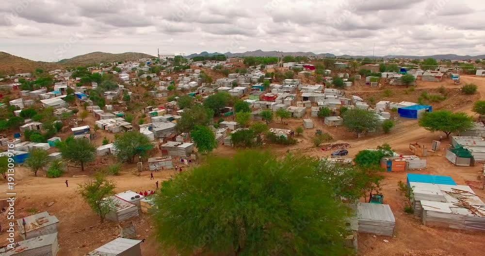 A bird's-eye view taken over a city with ruined houses in Namibia ...