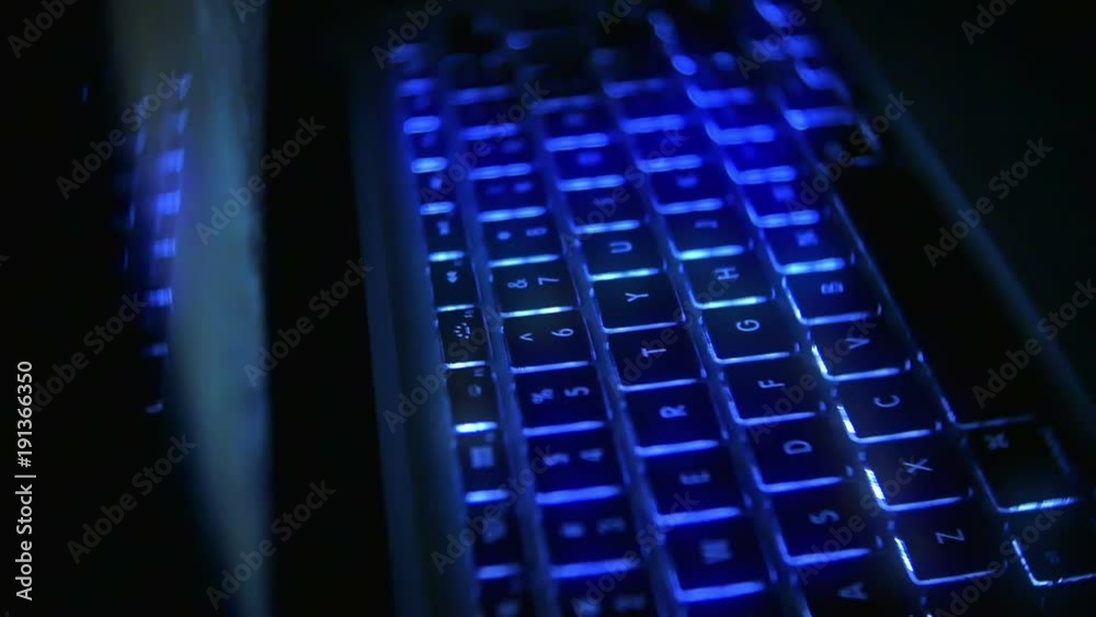 Laptop Keyboard Glowing Blue Light at Night in Slow Motion Stock Video ...