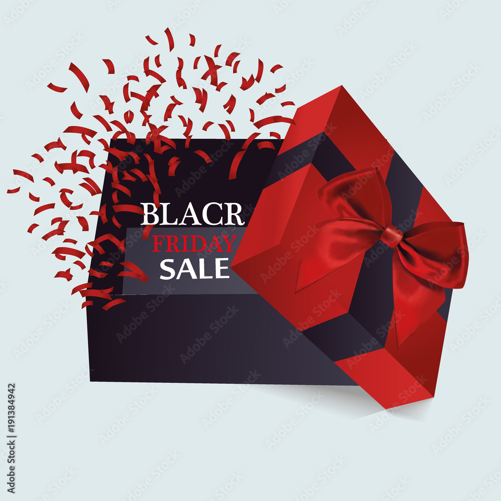 The box is red black open with a red ribbon bow. The box is open and ...