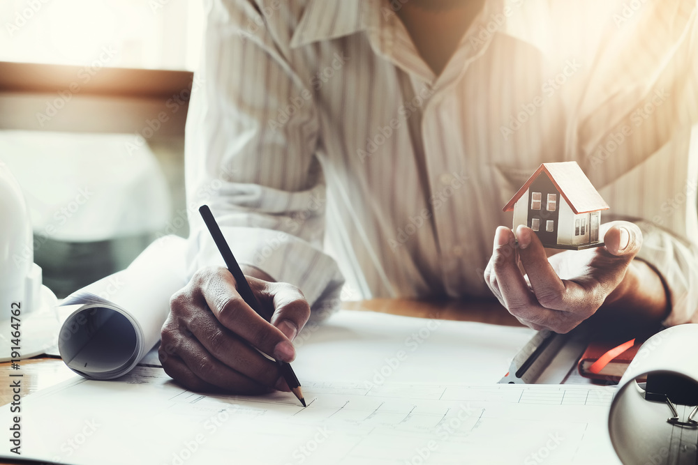 Architect design concept. Young engineer drawing of house structure on ...