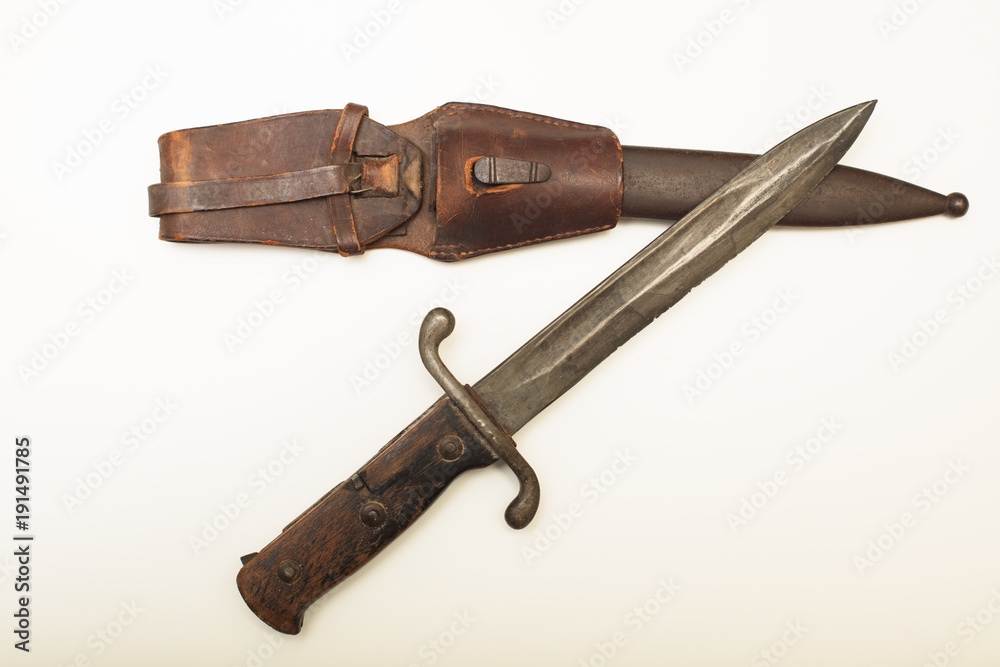 Old dagger with a worn leather sheath Stock Photo | Adobe Stock