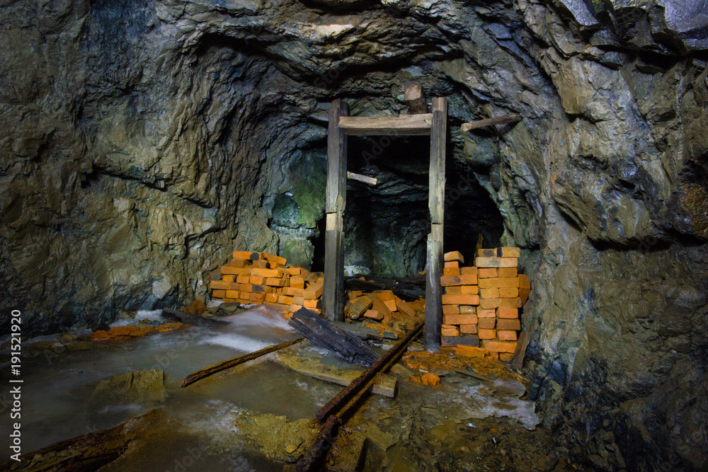 Underground abandoned ore mine shaft tunnel gallery with blocks Stock ...