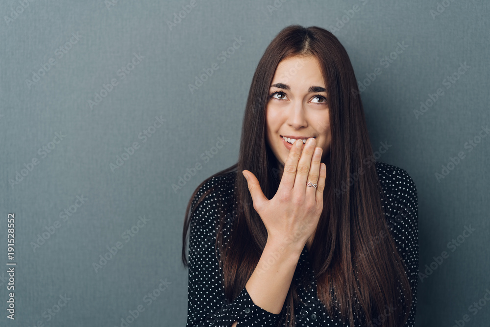 Embarrassed or polite young woman hiding her smile Stock Photo | Adobe ...
