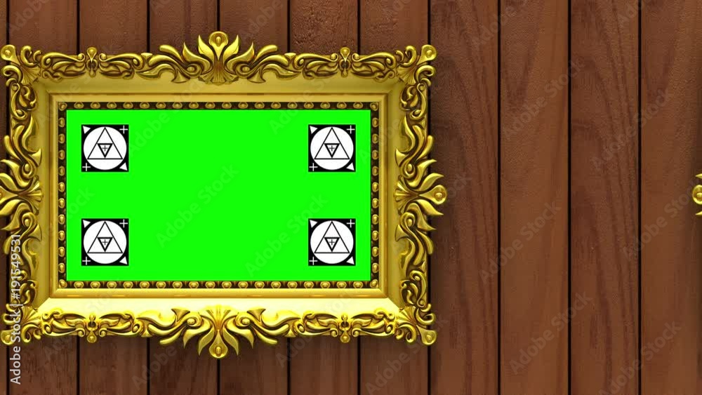 Camera moves along gold picture frames on brown wood background ...