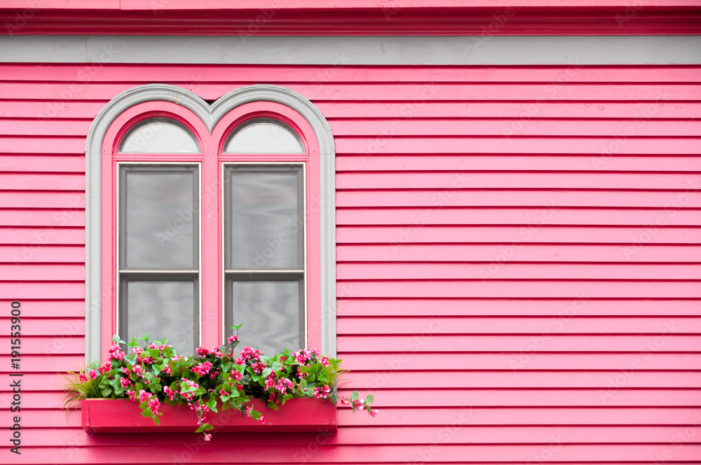 Arched Windows on a Colorful Pink House with Flower Boxes Stock Photo ...