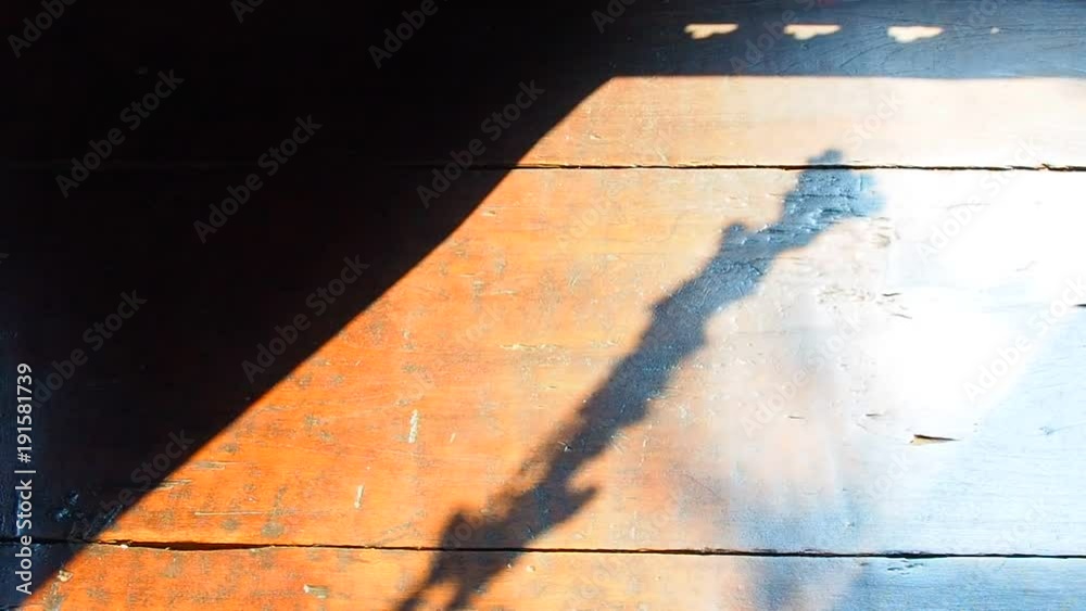 Old red brown wooden stripe tile floor, bright sunlight shining ...