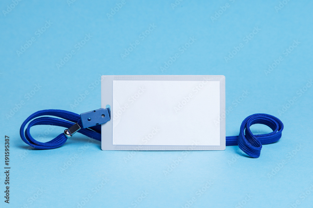 ID card badge with blue ribbon and on a blue background. mock-up. Stock ...
