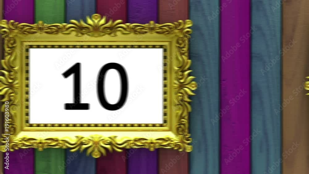 Countdown in gold picture frames on varicolored wood background. Mock ...