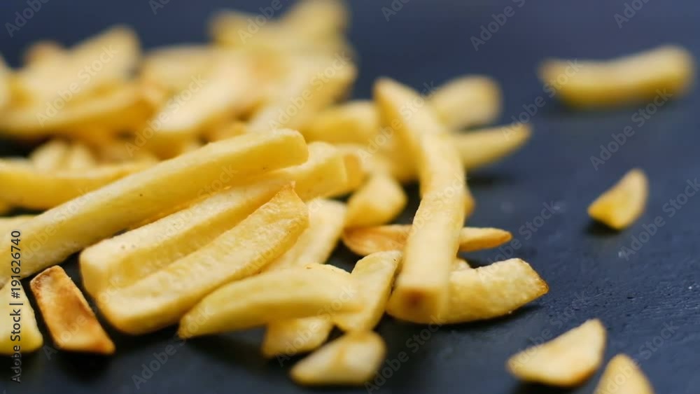 Video Stock french fries chips drop on the surface. fast food and ...