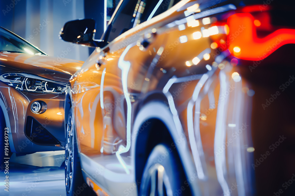 fashionable bright auto show A number of new cars parked in the car ...