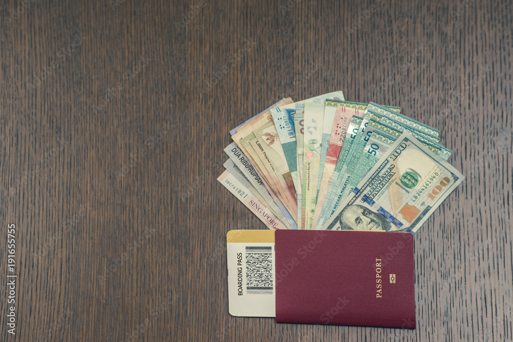 Foreign passport with boarding pass. Money of south-east Asia and ...
