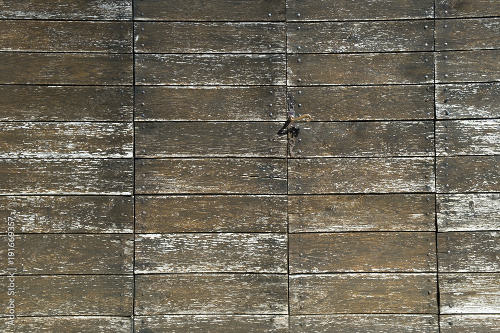 Full frame pattern of the planks of an unsual wooden door construction ...