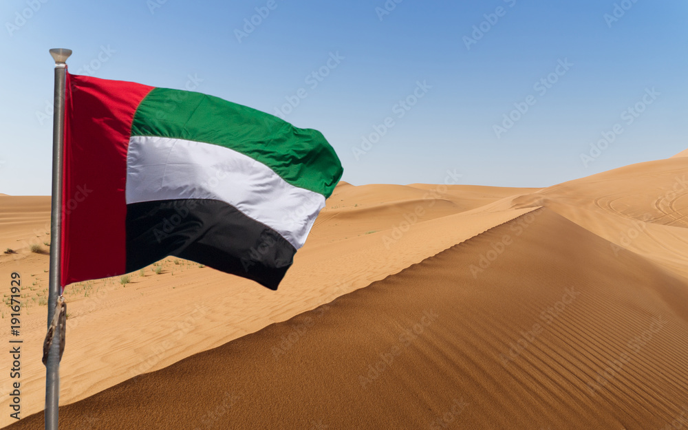 UAE flag with hypnotic patterns of sand desert in the UAE desert, near ...