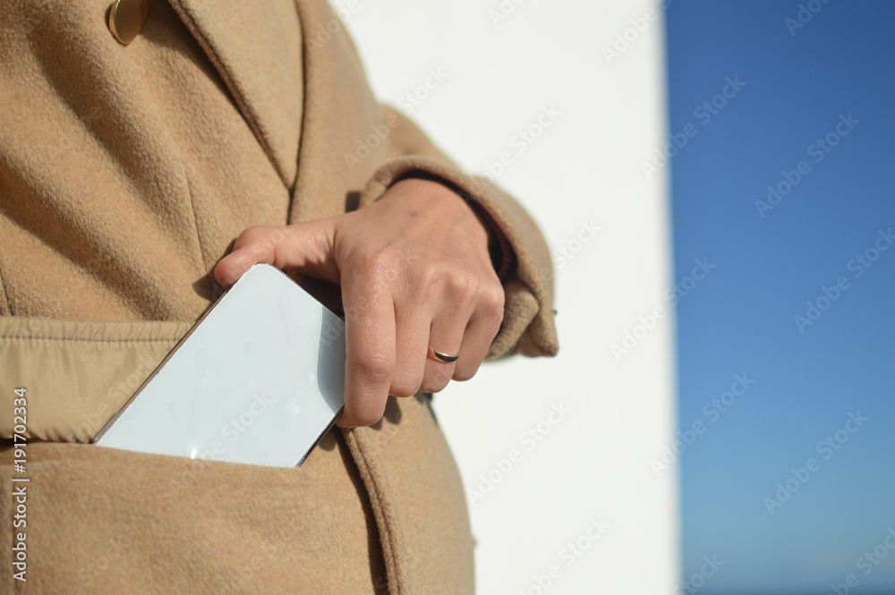 Closeup view of person holding using mobile smart phone. Sunny day ...