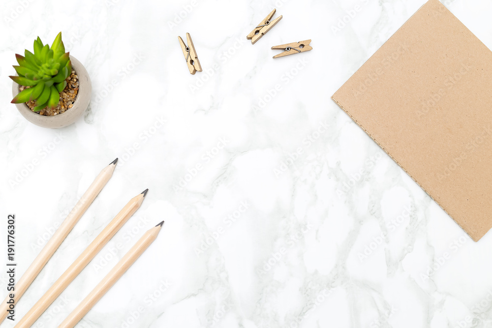 Diary for notes and pencils on a marble background background. Desk ...