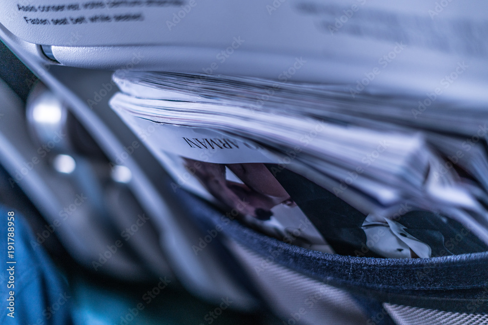 magazine holder on the back side of an airplane seat Stock Photo ...