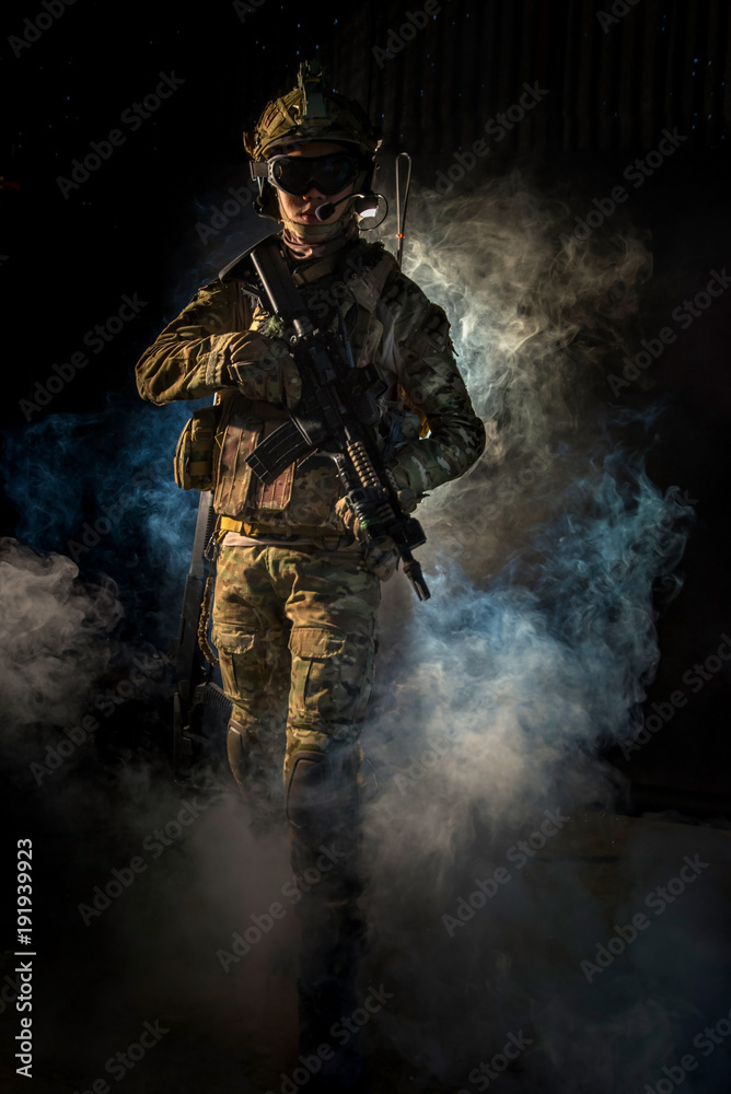 Soldier of the elite special purpose unit surveillance holding machine ...