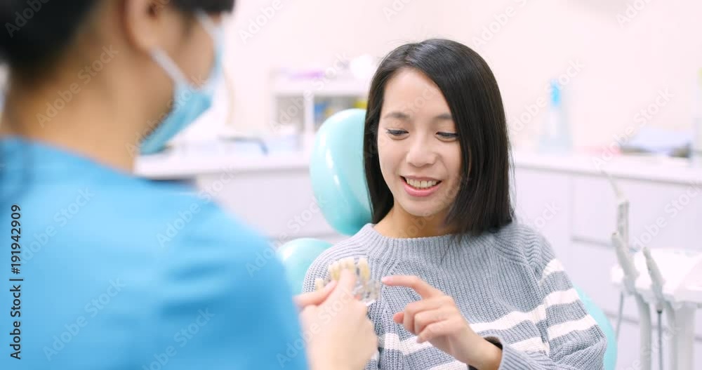 Dentist explaining the implant tooth to the patient Stock Video | Adobe ...