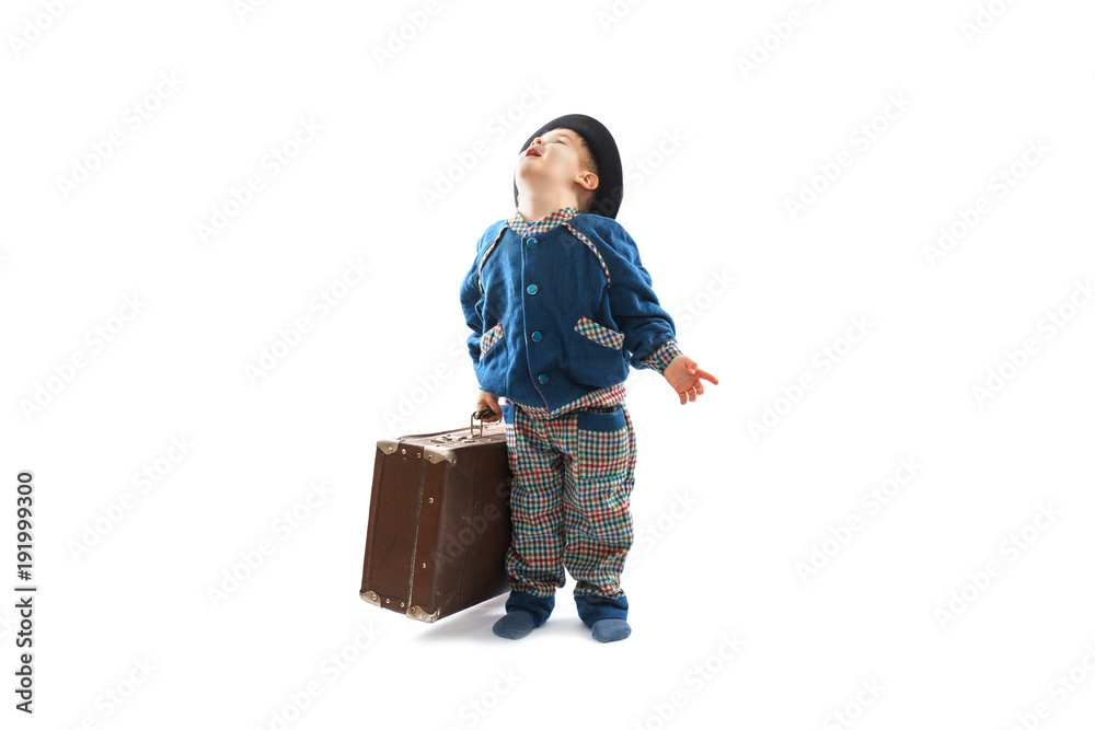Little boy with suitcase Stock Photo | Adobe Stock