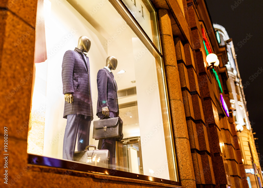 Night shop window with clothes on mannequins Stock Photo | Adobe Stock