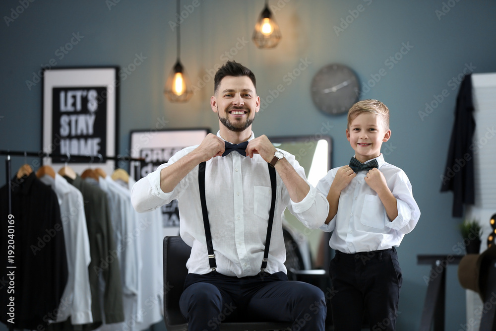 Father and son in elegant suits, indoors Stock Photo | Adobe Stock