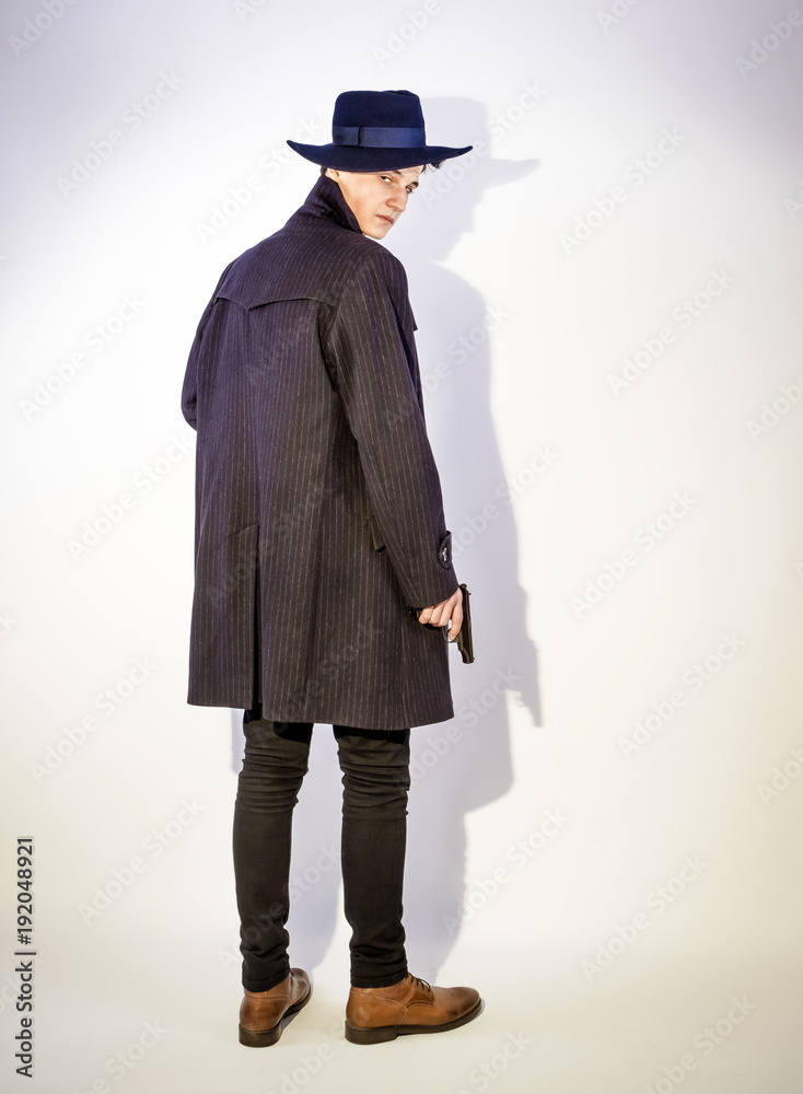 Spy. Secret Service. The detective holds a pistol pistol in his hand ...