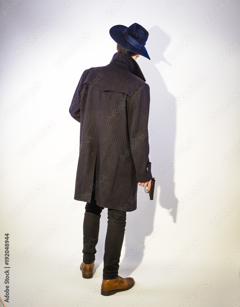 Spy. Secret Service. The detective holds a pistol pistol in his hand ...