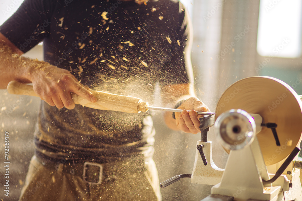 Wood lathe .The Carpenter lathing wood to make product Stock Photo ...