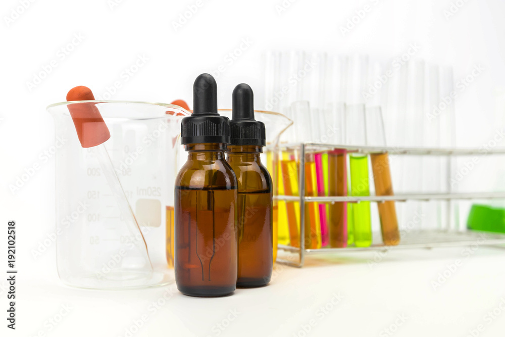 Stand with test tubes isolated on white. Several chemical solution in ...