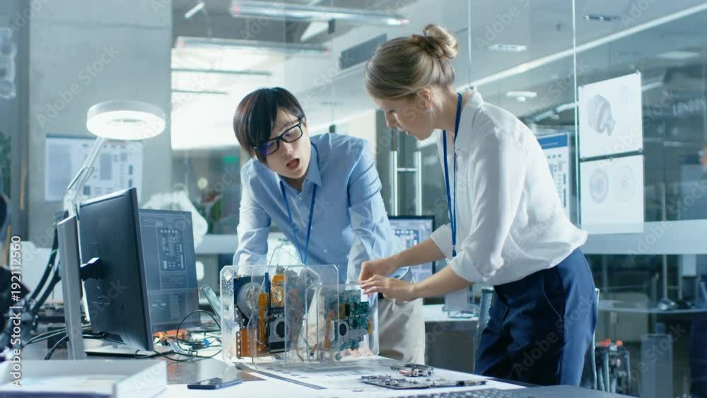 Two Computer Engineers Choose Printed Circuit Boards to Work with. In ...