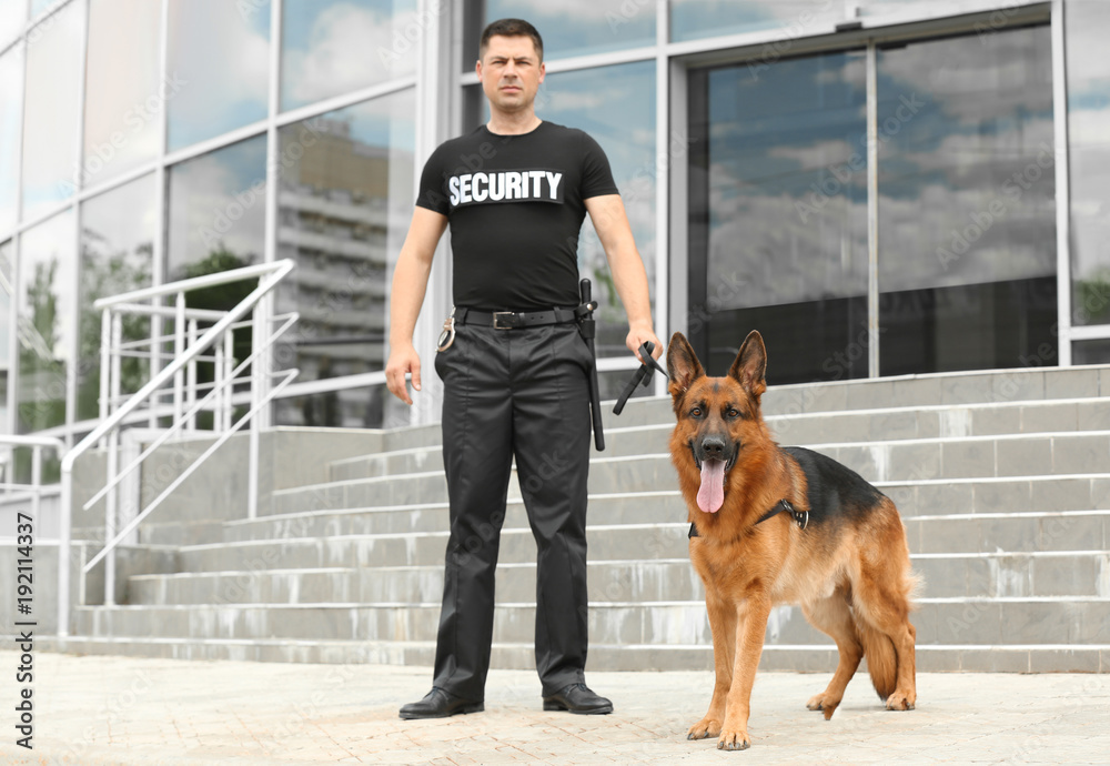Security guard with dog near building Stock Photo | Adobe Stock